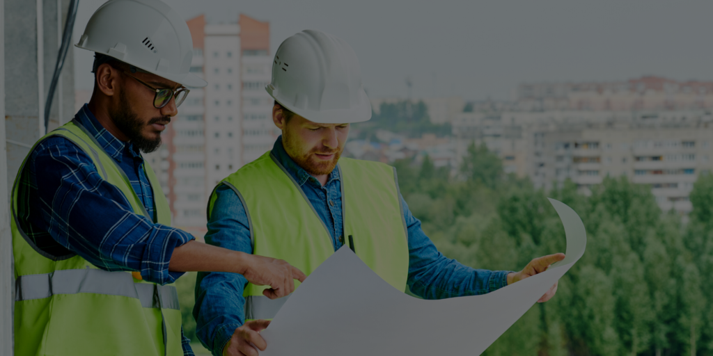 construction-workers-looking-at-plans | DJM Design CAD and Coordination